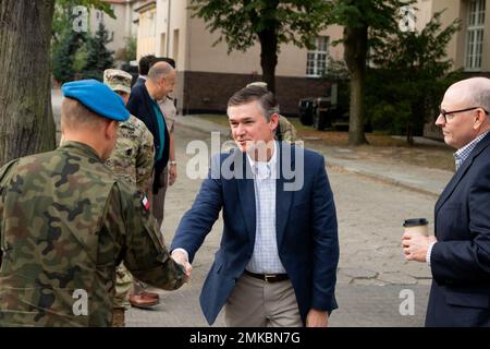 An officer of the Tank Corps on a Douglas motorbike with a spaniel dog ...