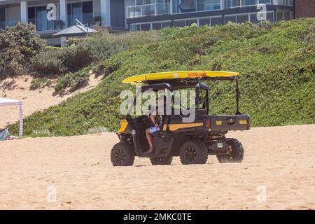 Australian surf rescue volunteer driving surf rescue beach buggy car ...