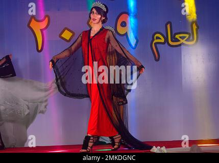 A model wearing a traditional Iraqi folk costume dances in the annual ...