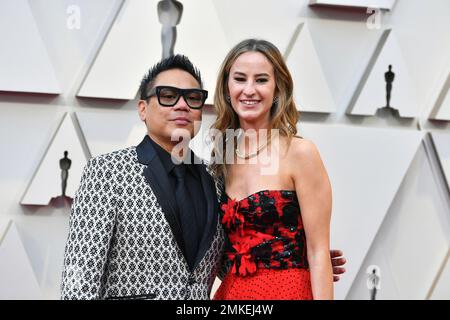 Matthew Libatique, left, and Magela Crosignani arrive at the Oscars on ...