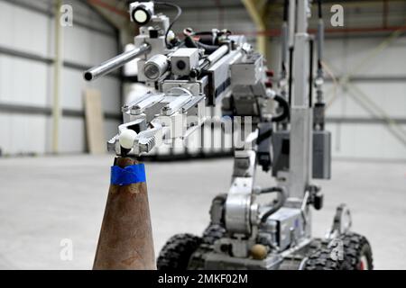 A remotely controlled Andros F6 robot is positioned to drop a ping pong ...