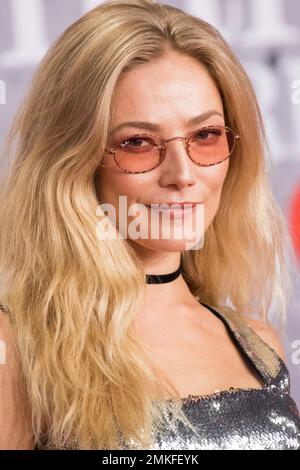 Clara Paget poses for photographers upon arrival at the British Fashion Awards in London, Monday ...