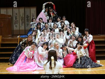 South Korean seniors clad in traditional attire pose for a souvenir ...