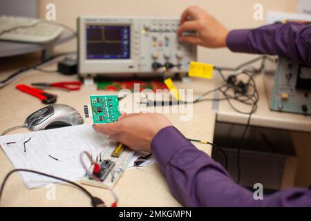engineers work with electrical measuring devices Stock Photo - Alamy