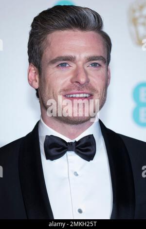 Richard Madden poses for photographers upon arrival at the premiere of ...