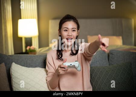 The young lady to play video games at home Stock Photo - Alamy