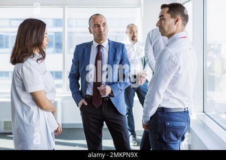 The team that is here to create. Portrait of a group of diverse ...