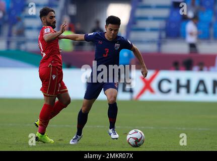 Bahrain's midfielder Ali Madan, left, and United Arab Emirates ...
