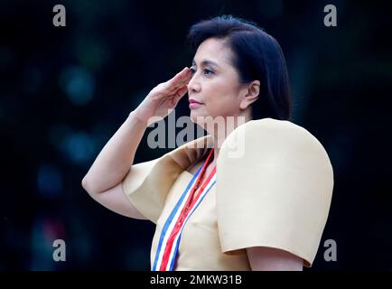 Philippine Vice President Maria Leonor "Leni" Robredo, center, leads ...