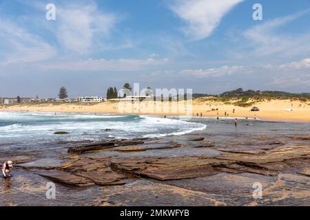 North Narrabeen beach on east coast of Sydney, large rock ledge around ...