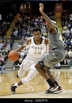 Vanderbilt forward Aaron Nesmith (24) drives against Alabama forward ...