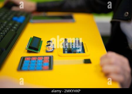 engineers assemble electrical circuits from radio components in a ...