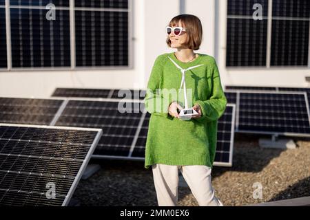 Happy house owner with a solar plant Stock Photo - Alamy