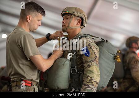 A U.S. Army Jumpmaster conducts a Jumpmaster Personel Inspection (JMPI ...