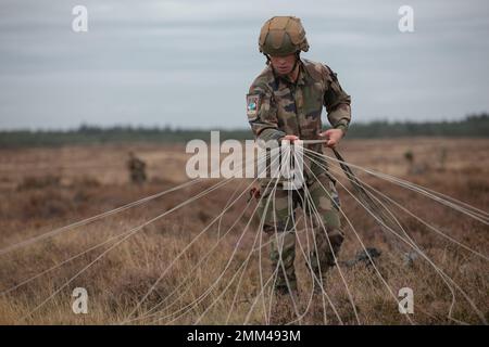 A French Paratrooper derigs his Polish parachute after landing on the ...