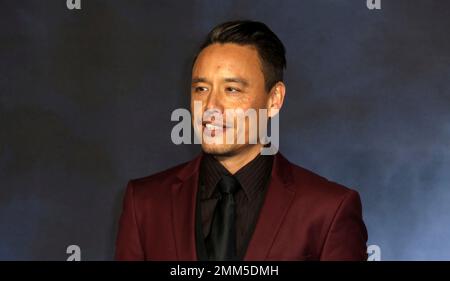 Actor SImon Wan poses for photographers on arrival at the premiere of ...