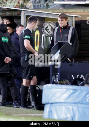 Referee Don Robertson checks VAR before giving Rangers' Dujon Sterling ...