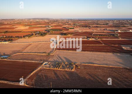 Drone view of fields with red soil around Avgorou village in Famagusta ...