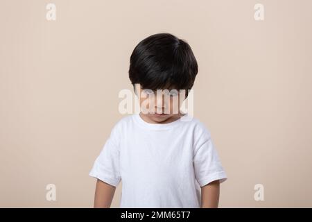 scolded or sad little Mexican boy, sad expression Stock Photo - Alamy