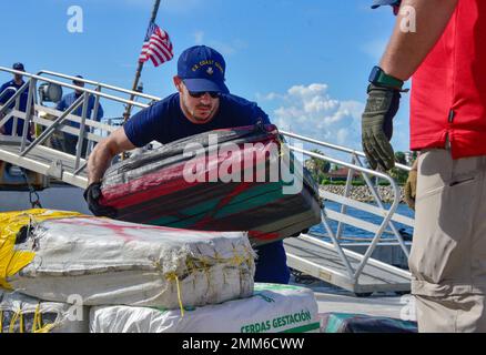 Bales of illegal drugs, worth an estimated $475 million, are offloaded ...