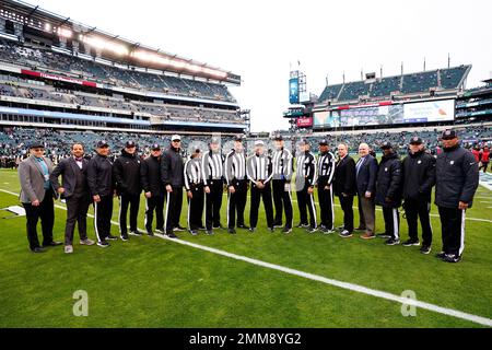 From left, back judge Terrence Miles (111), side judge Allen Baynes (56 ...