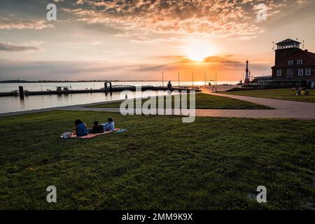 View of the Weser estuary and Strandhalle at sunset from the dyke ...