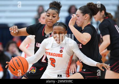 Louisville forward Nyla Harris, left, tries to keep the ball as Alabama ...