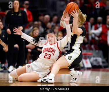 Ohio State's Rebeka Mikulasikova, left, shoots over Wright State's ...