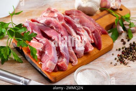 Raw fillet of farm Turkey thigh. Dark wooden background. Top view Stock ...