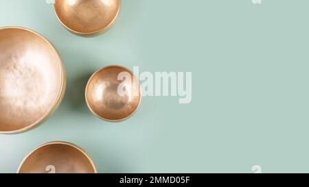 tibetan singing bowls on green grass in park Stock Photo - Alamy