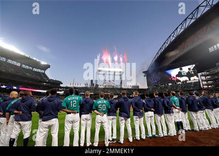 Seattle Mariners players line-up during introductions before a baseball ...