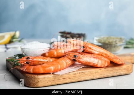 Delicious cooked shrimps on grey marble table krop in the back. Nice ...
