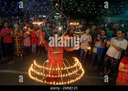 An Indian man Rajnikant Pandya, 42, wears a framed costume decorated by ...