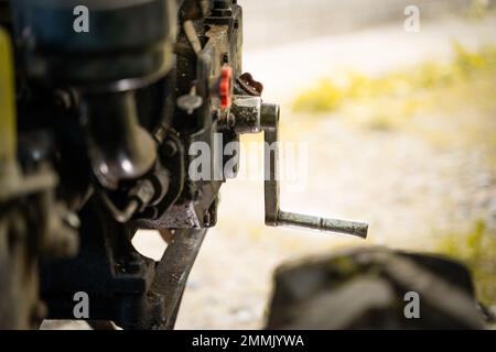 Crooked starter for starting the engine of a walk-behind tractor close ...