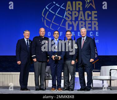 Retired Space Force Lt. Gen. William Liquori, center, poses after being ...