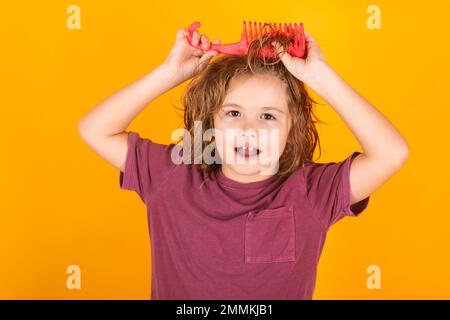 Child combing hair after shower. Little kid combing hair, isolated ...