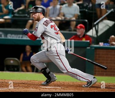 Texas Rangers' Robbie Grossman hits a single during the eighth inning ...