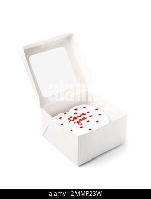 Opened box with tasty bento cake isolated on white background ...