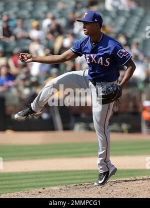 Texas Rangers' Jose Leclerc throws to the Baltimore Orioles in a ...