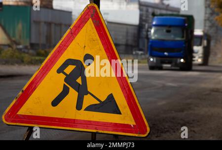 Roadworks warning sign ahead on street sidewalk. Close-up Stock Photo ...