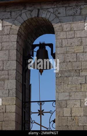 Large Church bell hanging outside. Close-up view of metal orthodox ...