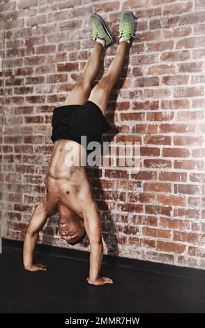 Hes a lean mean fighting machine. Shot of a middle-age boxer working ...