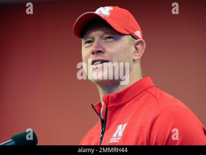 Nebraska football coach Bob Devaney happily collects kisses from Orange ...