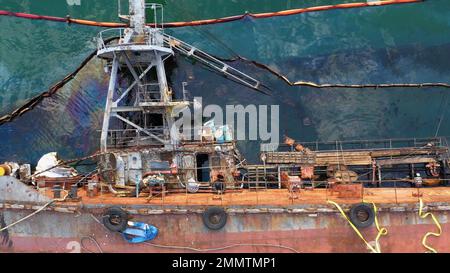 Aerial top view of overturned broken rusty oil tanker ship after the ...