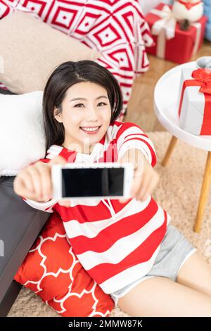 Young women use tablet phone at home Stock Photo - Alamy