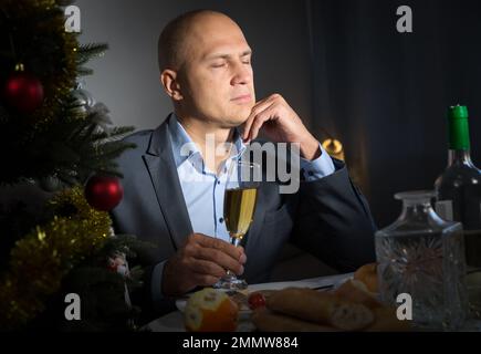Tired man celebrating New Year Stock Photo - Alamy