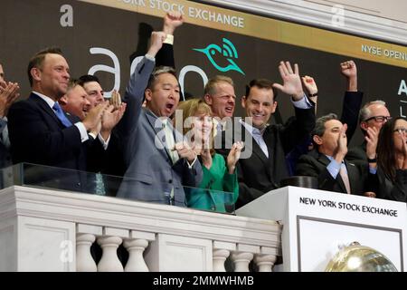 Arlo Technologies CEO Matthew McRae, right, rings a ceremonial bell on ...
