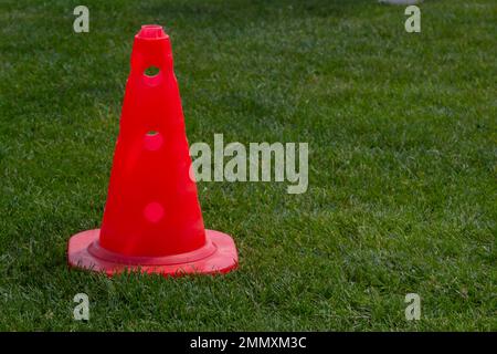Plastic chips and cone for football training. Sports playground with ...