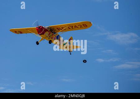 Kent Pietsch, piloting his Interstate Cadet, performs aerobatics during ...