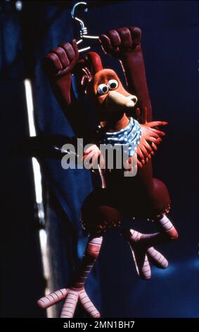 CHICKEN RUN, 2000, Rocky (Mel Gibson), pampered by the hens. Babs (Jane ...